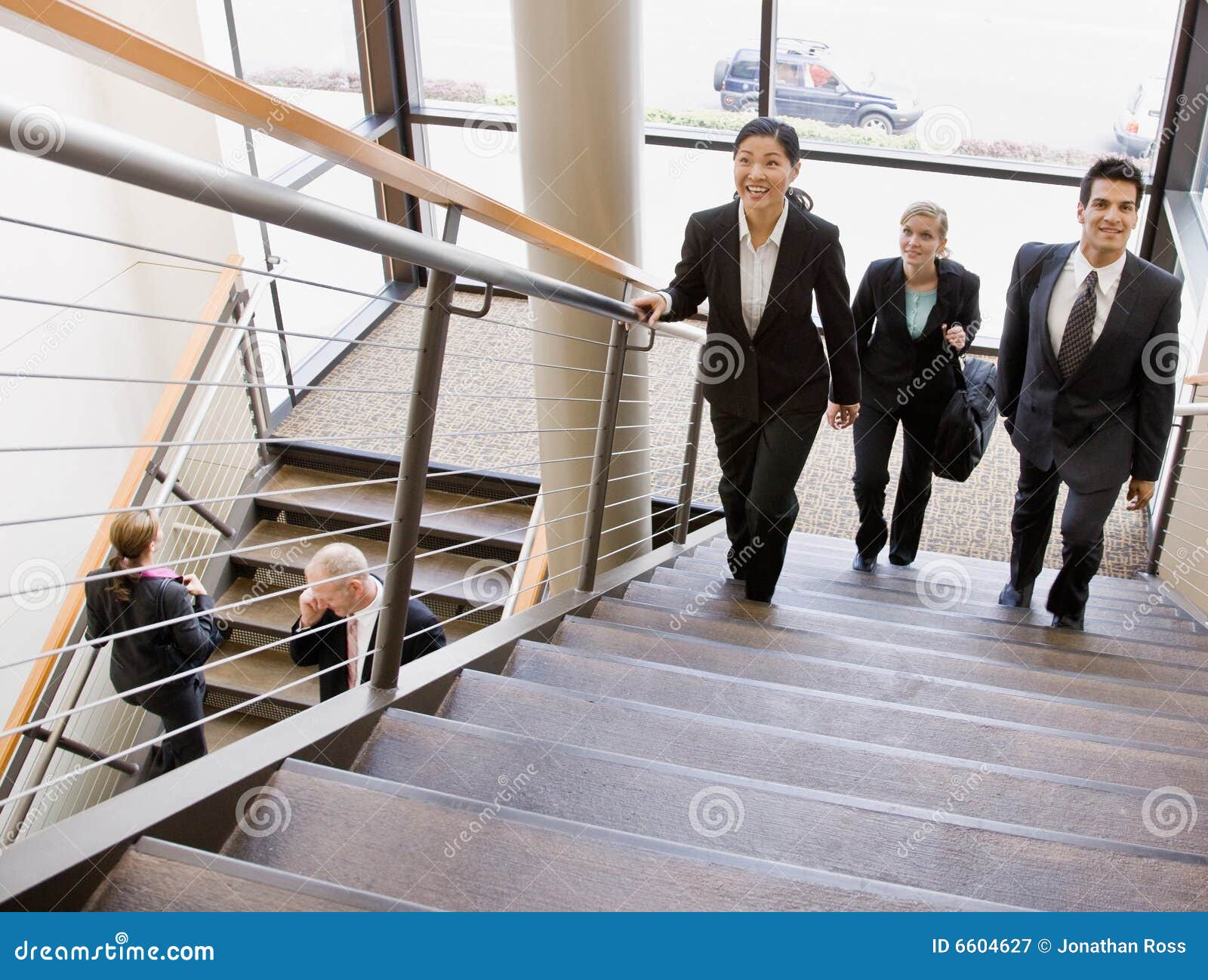Multi-ethnic Workers Ascending Office Stairs Stock Image - Image of ...