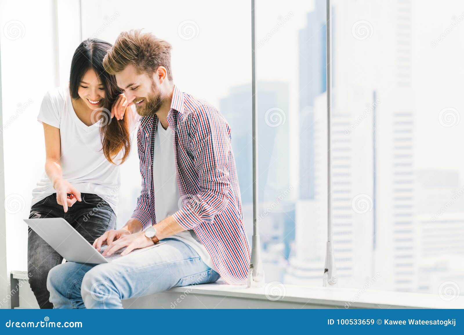 Multi-ethnic Young Couple or College Student Using Notebook Laptop ...
