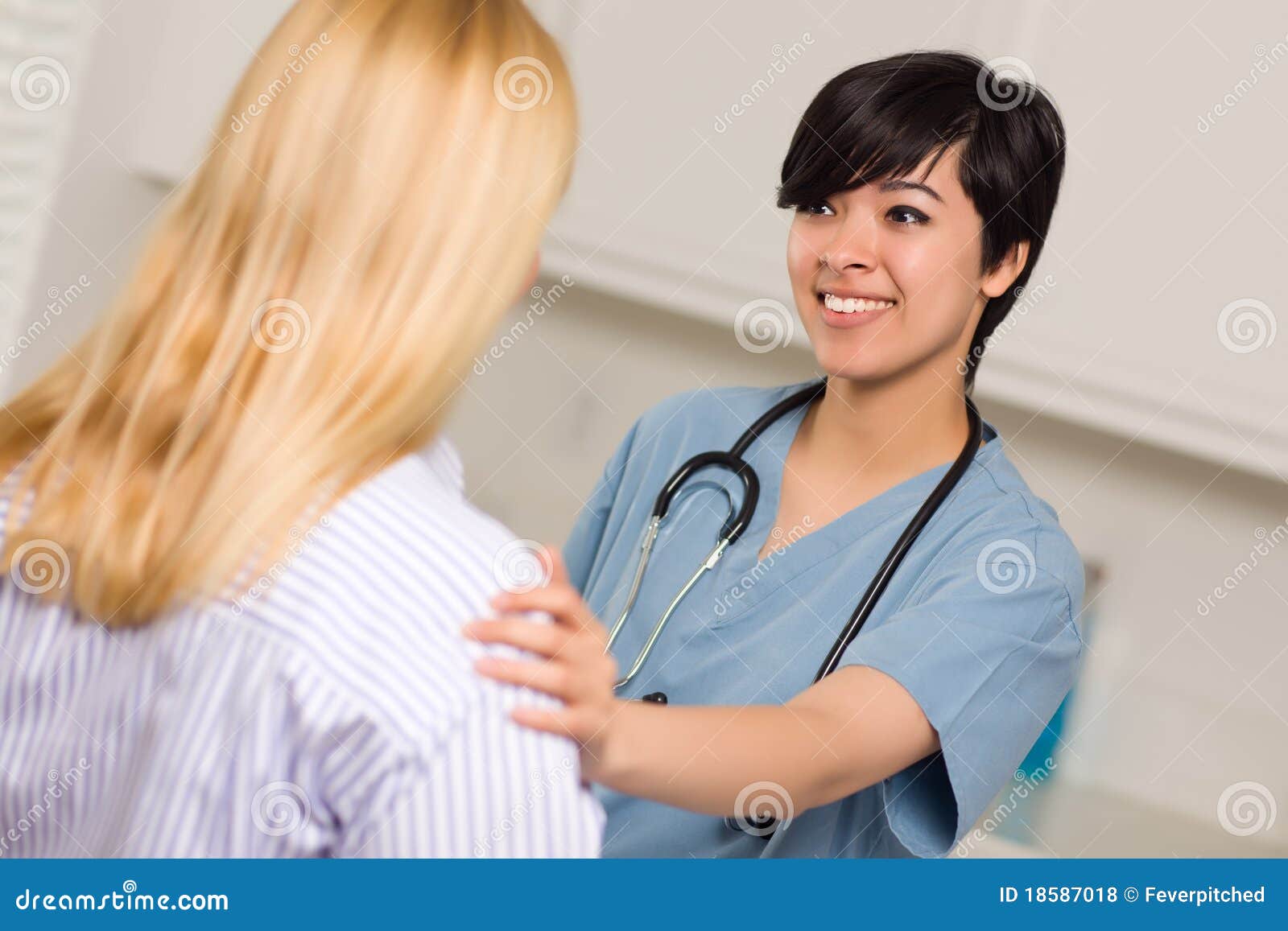 Multi-ethnic Young Female Doctor with Patient Stock Photo - Image of ...