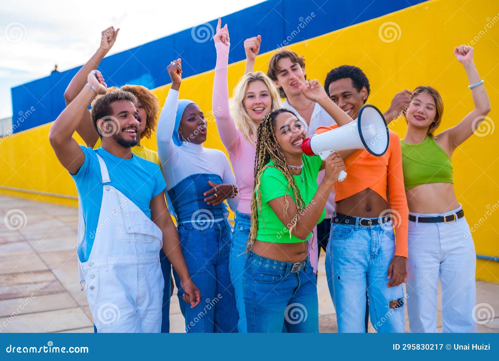 Multi-ethnic Young People Yelling Using a Loudspeaker Stock Image ...