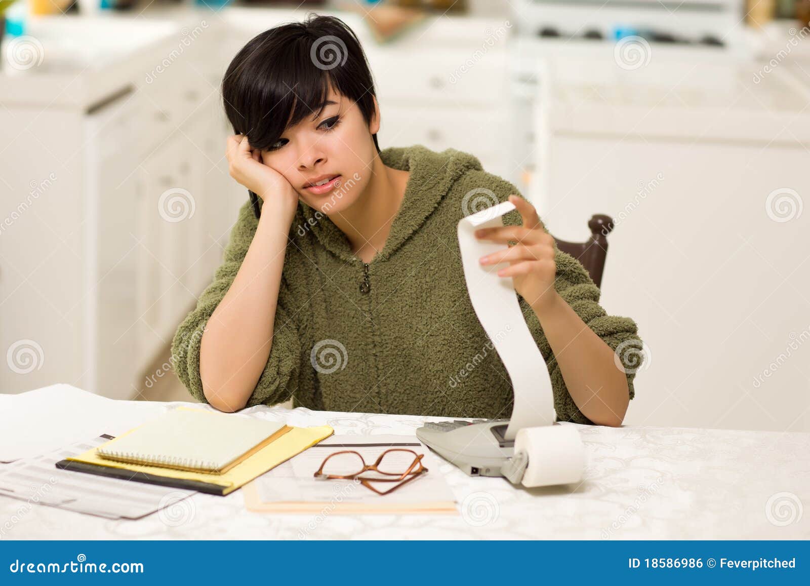 Multi-ethnic Young Woman Agonizing Over Financials Stock Photo - Image ...