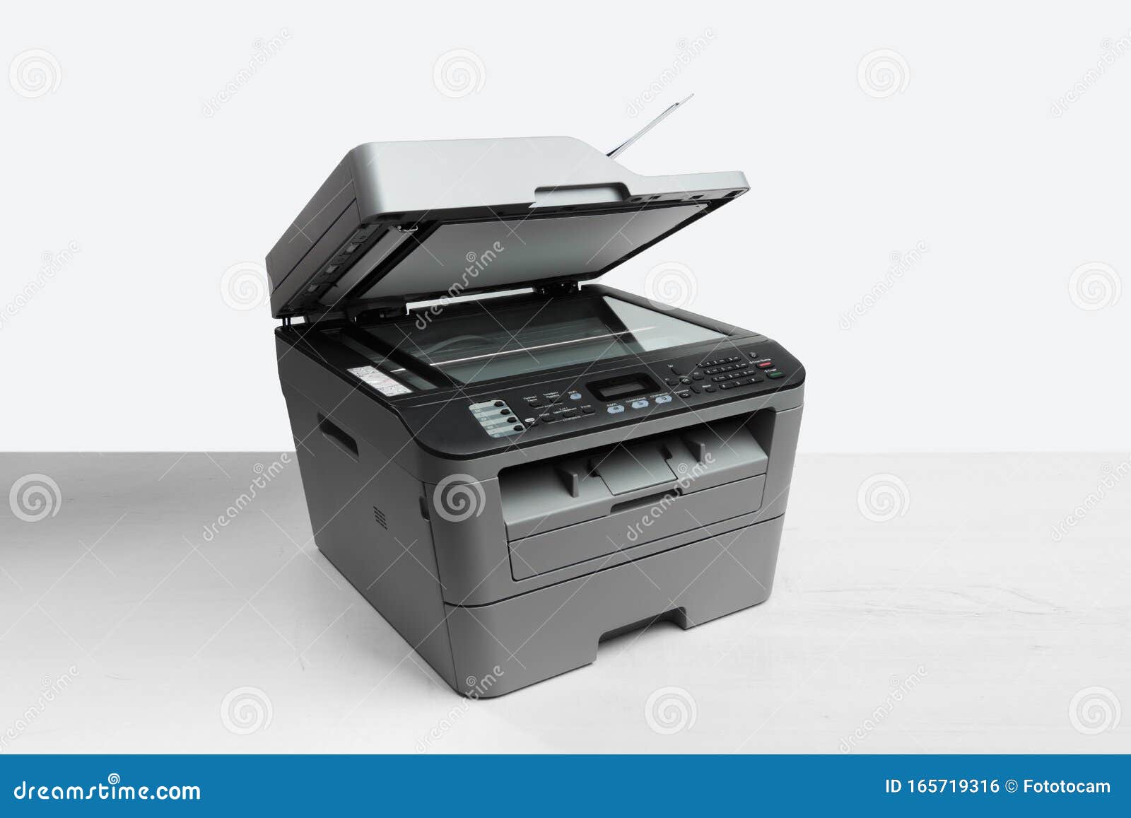 A Multi Function Printer, Copier, Scanner on Office Table. Gray Wall ...