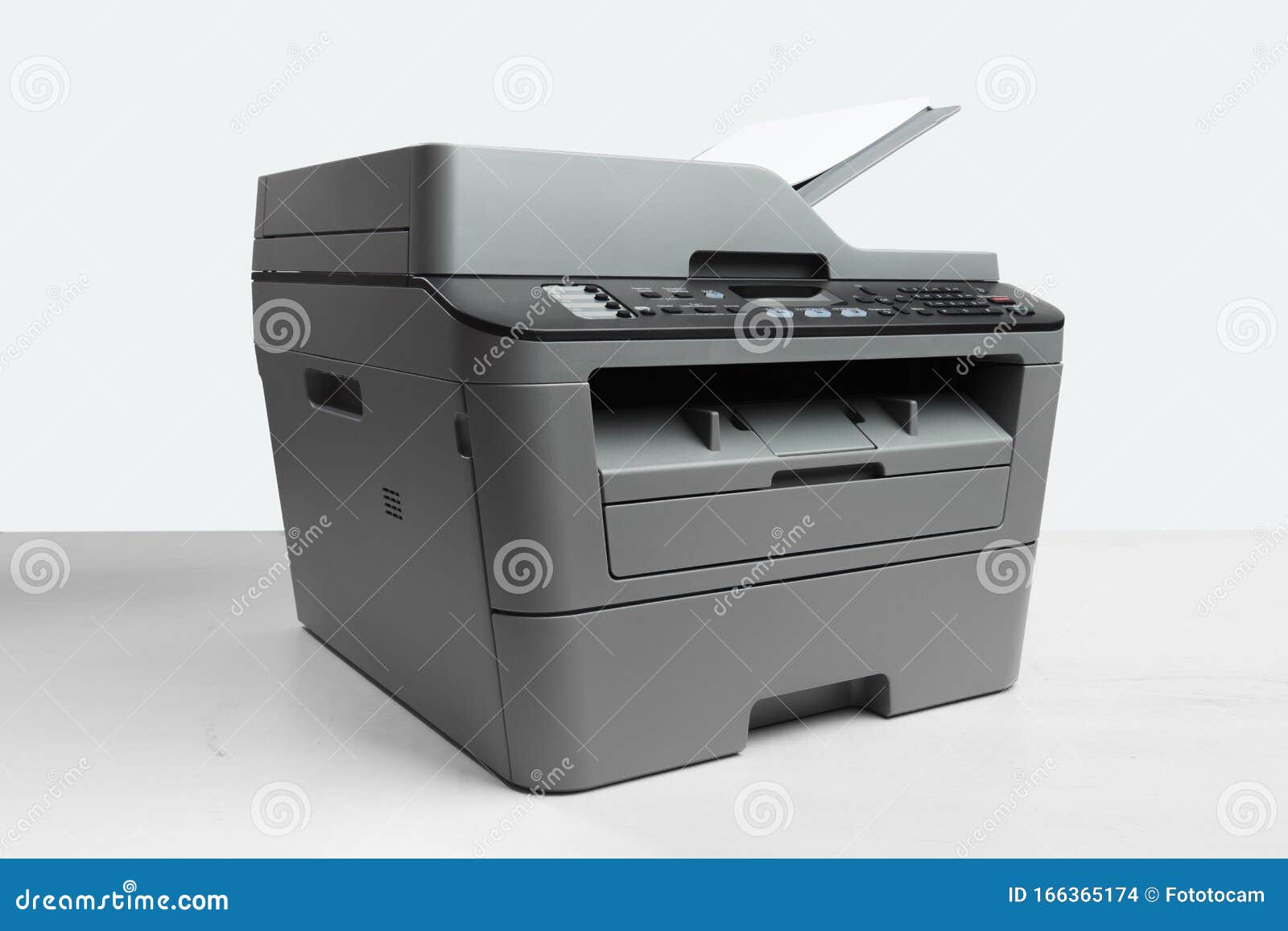 A Multi Function Printer, Copier, Scanner on Office Table. Gray Wall ...