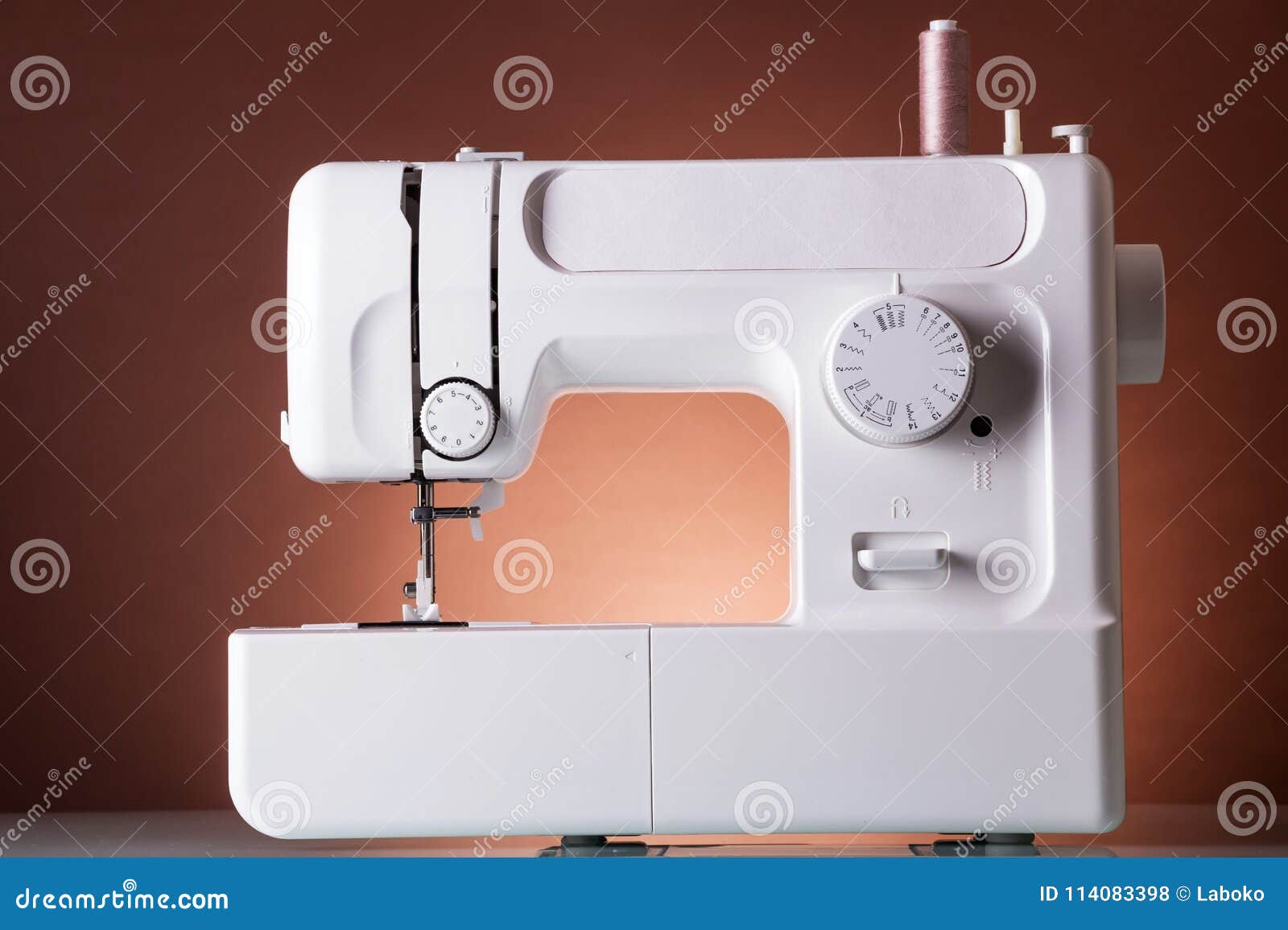 Multi-functional Sewing Machine, on Dark Red Background Stock Photo ...