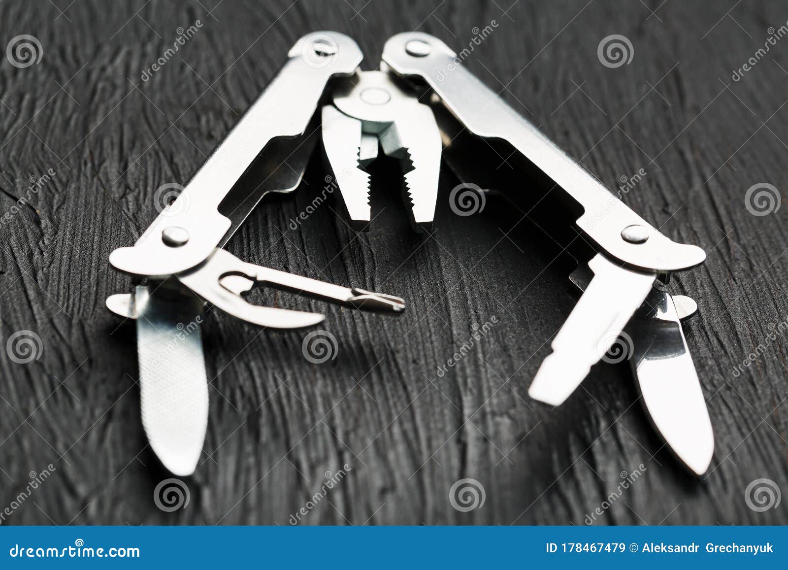 Multi-functional Tool on a Black Textural Background. Stock Image ...