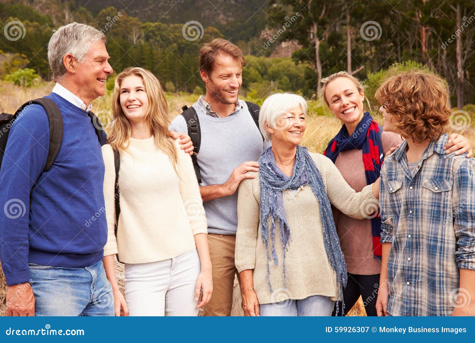 Family Bonding Together, Smiling And Reading On The Sofa, Studio Shot ...