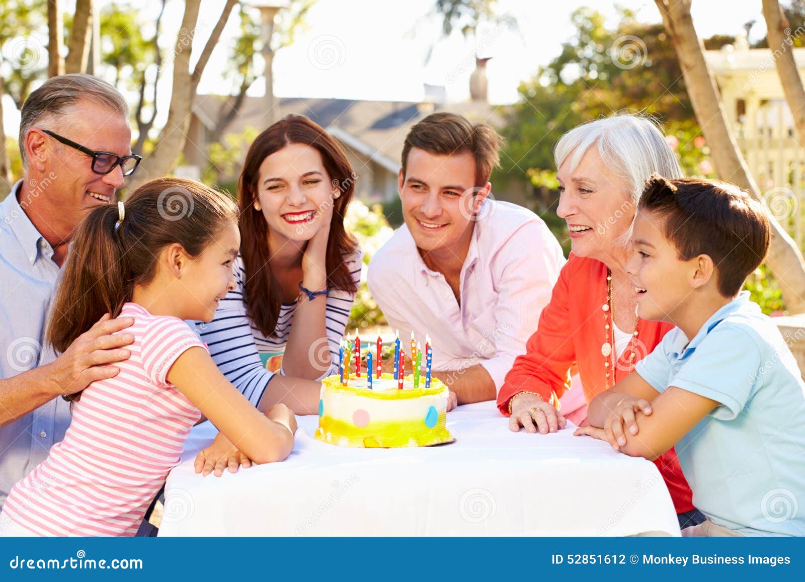 Multi-Generation Family Celebrating Birthday in Garden Stock Photo ...