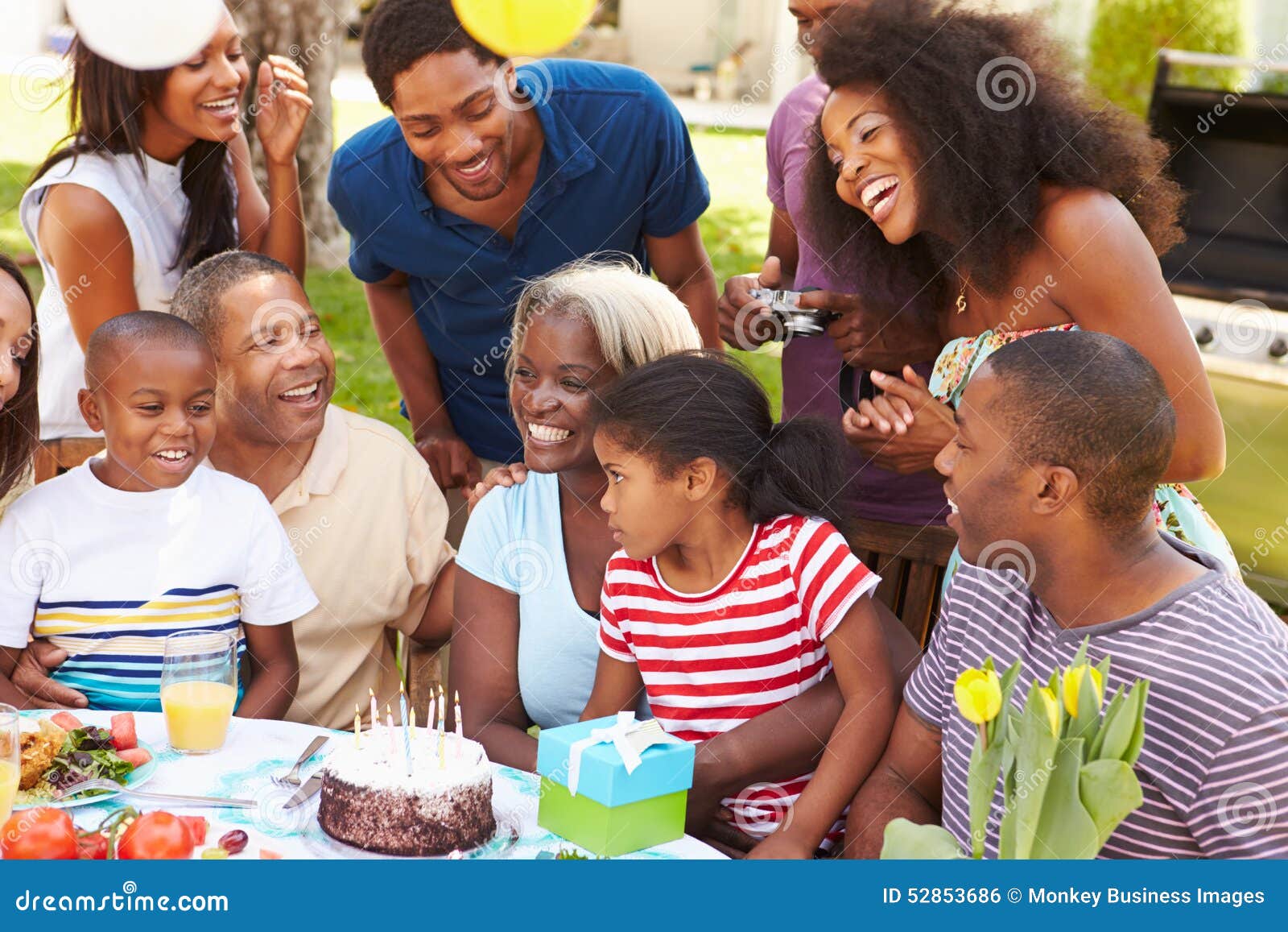 Multi Generation Family Celebrating Birthday in Garden Stock Photo ...