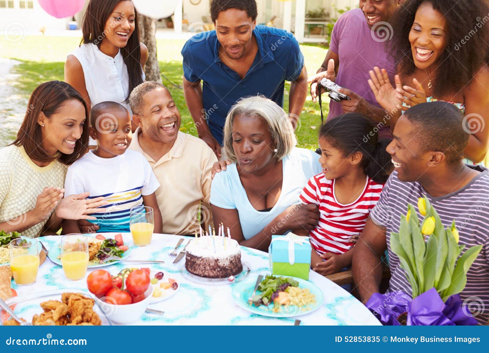 Multi Generation Family Celebrating Birthday in Garden Stock Image ...