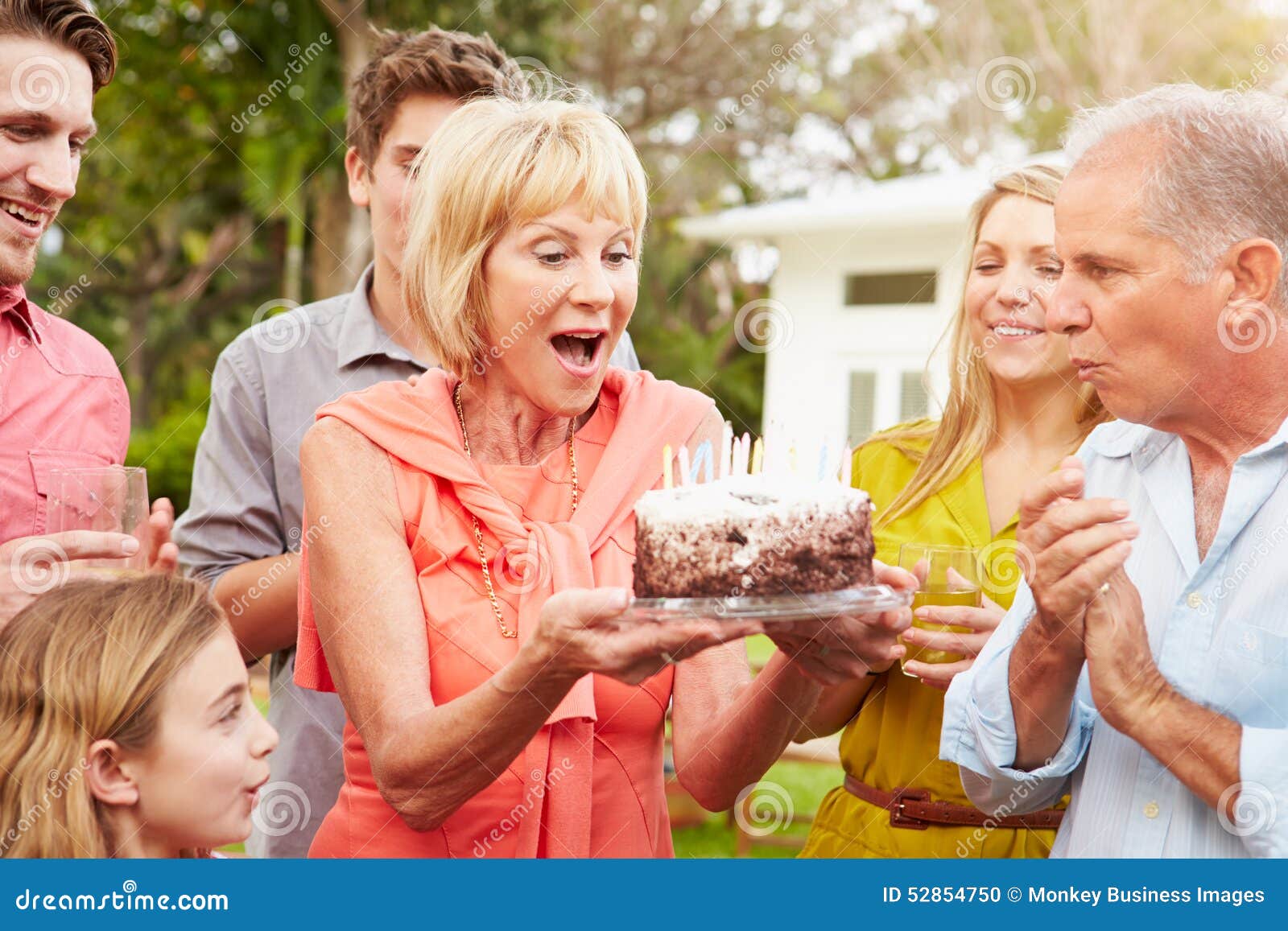 Multi Generation Family Celebrating Birthday in Garden Stock Photo ...