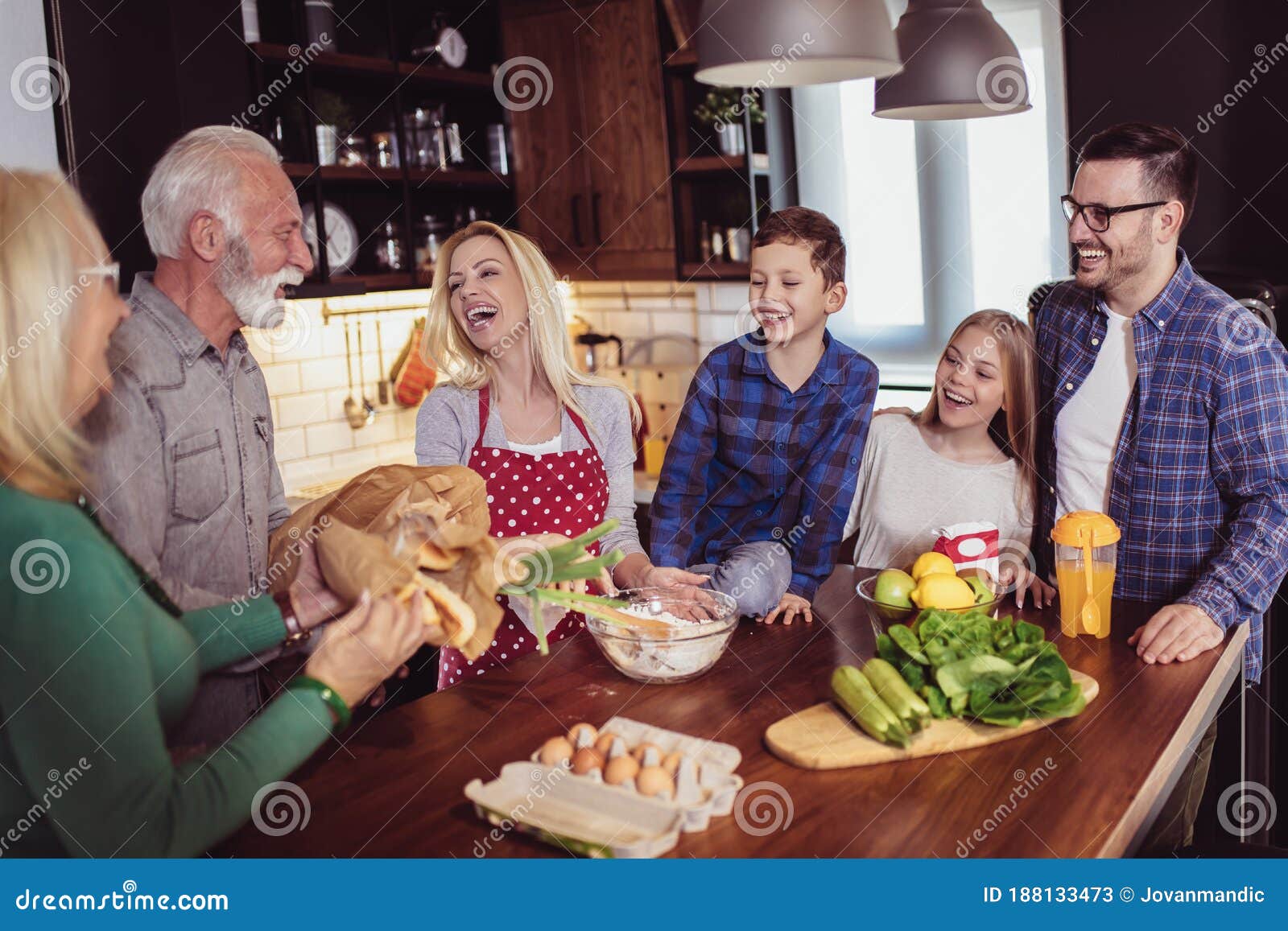Multi Generation Family Cooking Meal at Home Stock Image - Image of ...
