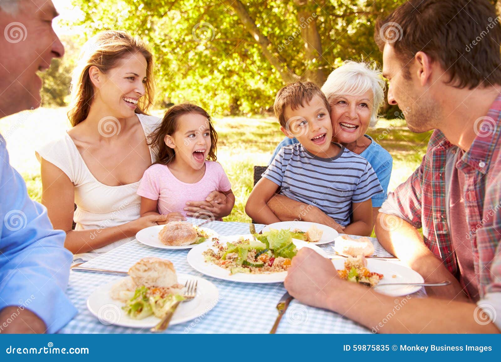 Multi-generation Family Eating Together Outdoors Stock Image - Image of ...