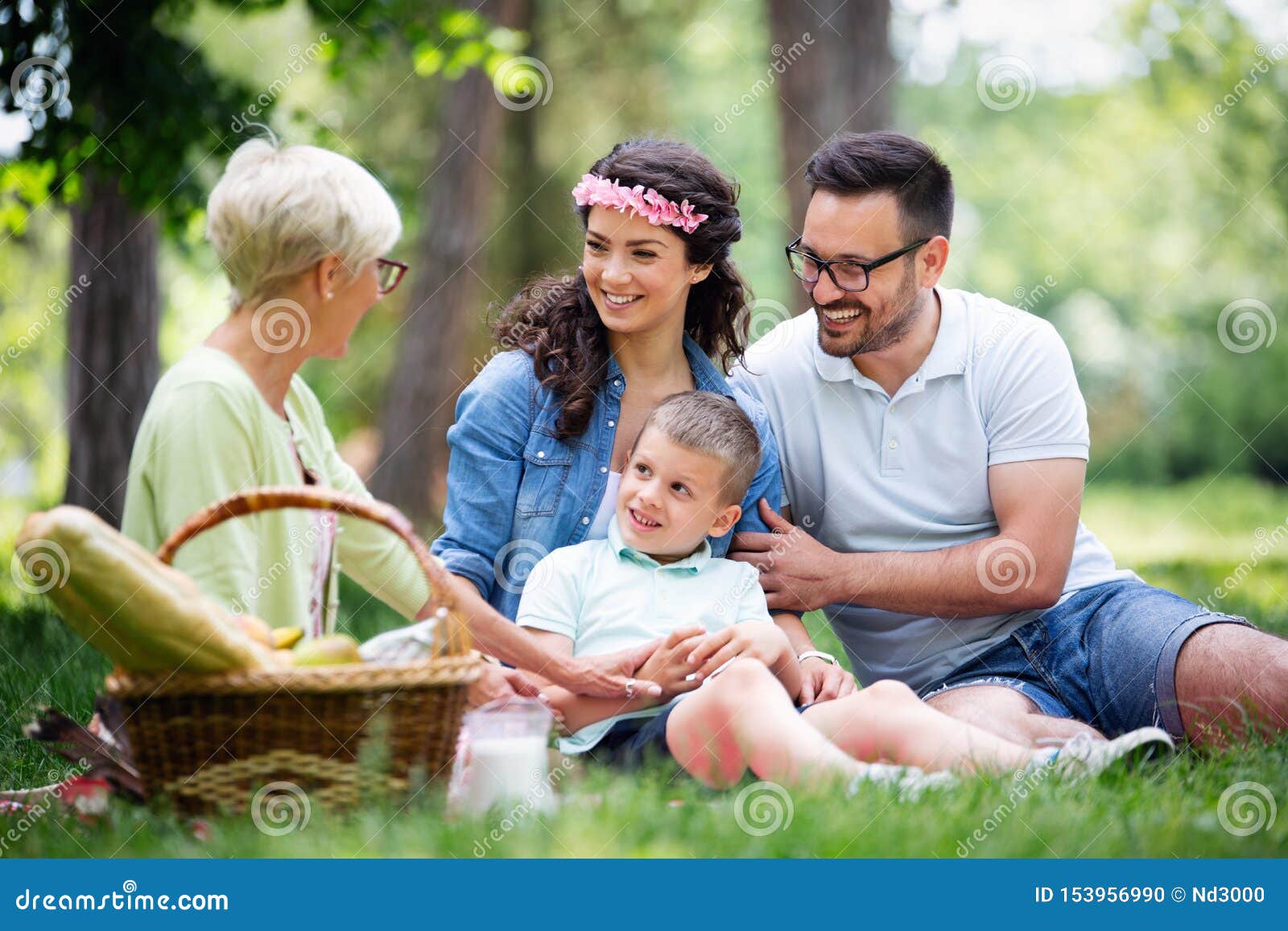 Multi Generation Family Enjoying Picnic in a Park Stock Photo - Image ... Multi Generation Family Enjoying Picnic in a Park Stock Photo - Image ...