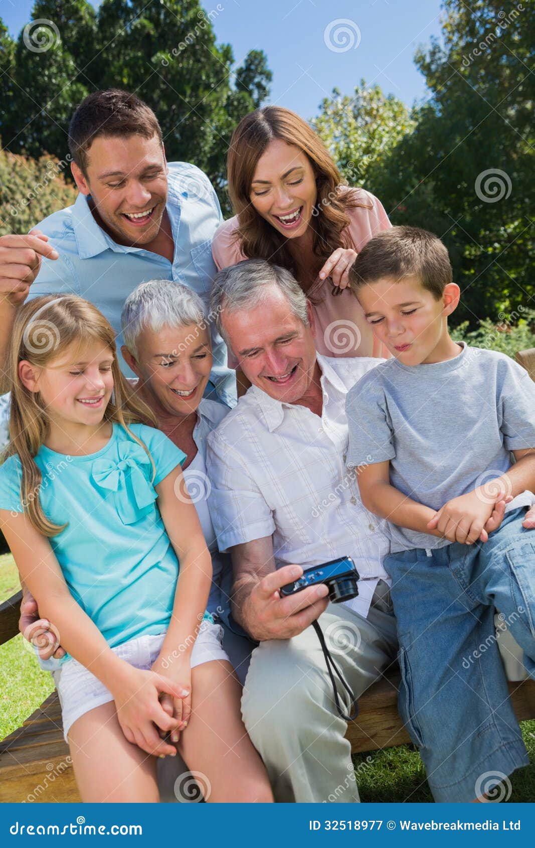 Multi Generation Family Looking at Photos Stock Image - Image of girl ...