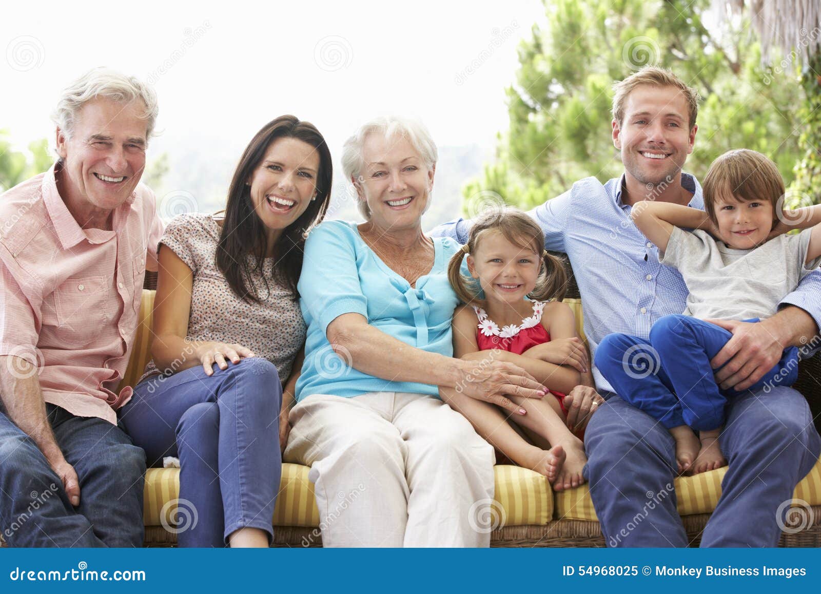Multi Generation Family Sitting on Garden Seat Stock Image - Image of ...