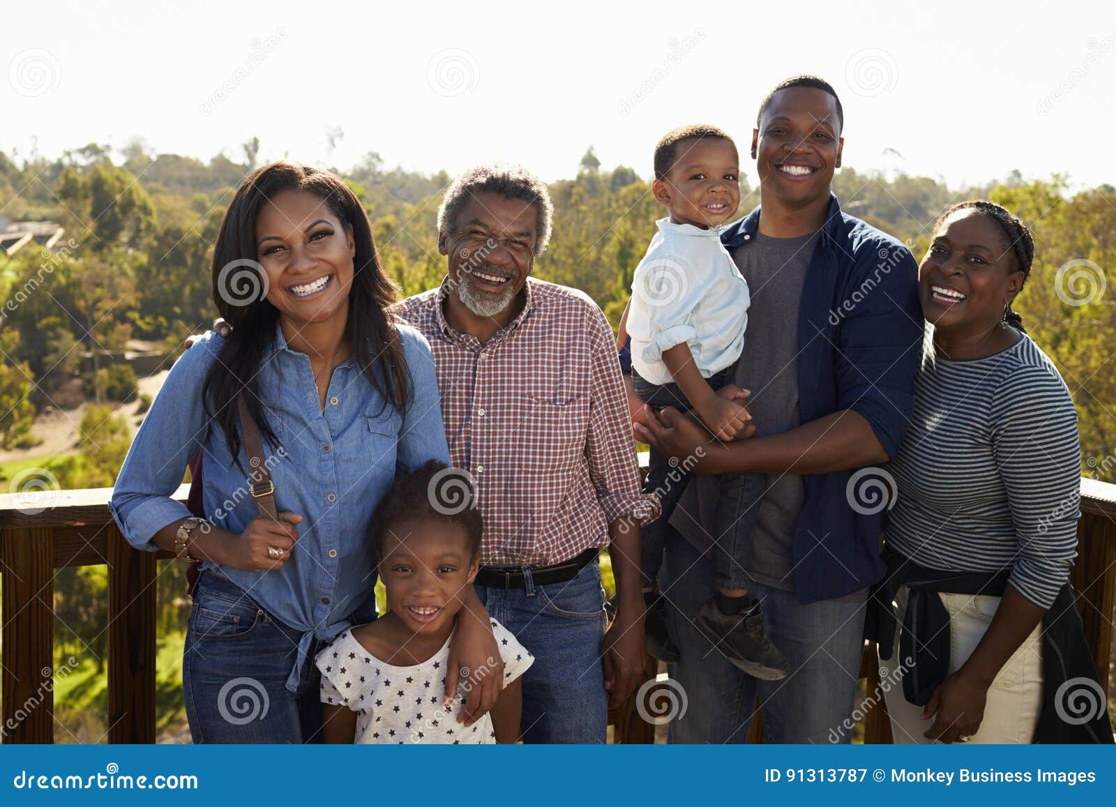 Multi Generation Family Standing on Outdoor Observation Deck Stock ...