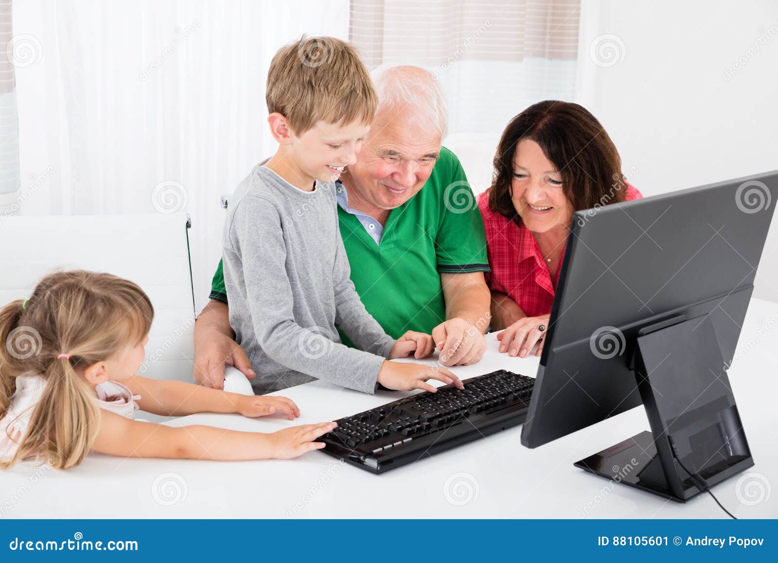 Multi Generation Family Using Desktop Together at Home Stock Image ...