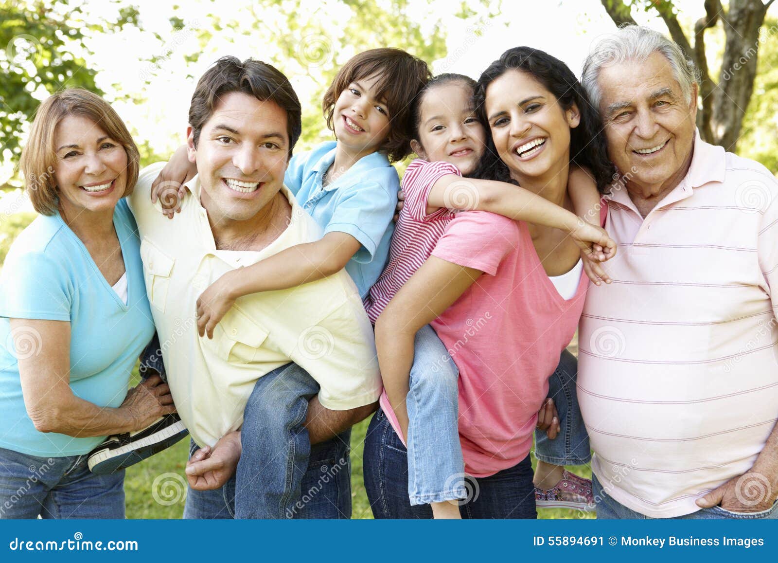 Multi Generation Hispanic Family Standing in Park Stock Image - Image ...