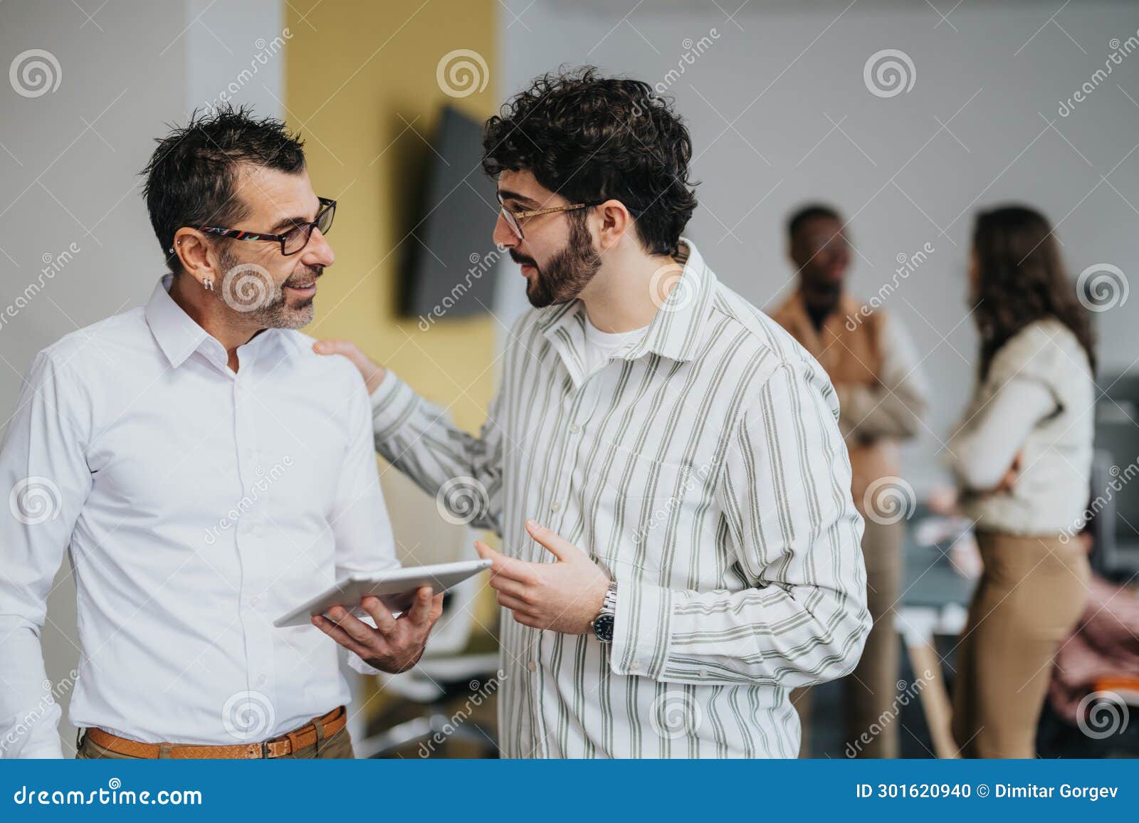 Multi Generational Business Partners Collaborating in a Creative Office ...