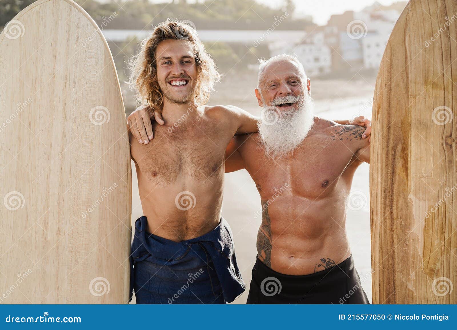 Multi Generational Surfer Friends Having Fun on the Beach after Surf ...