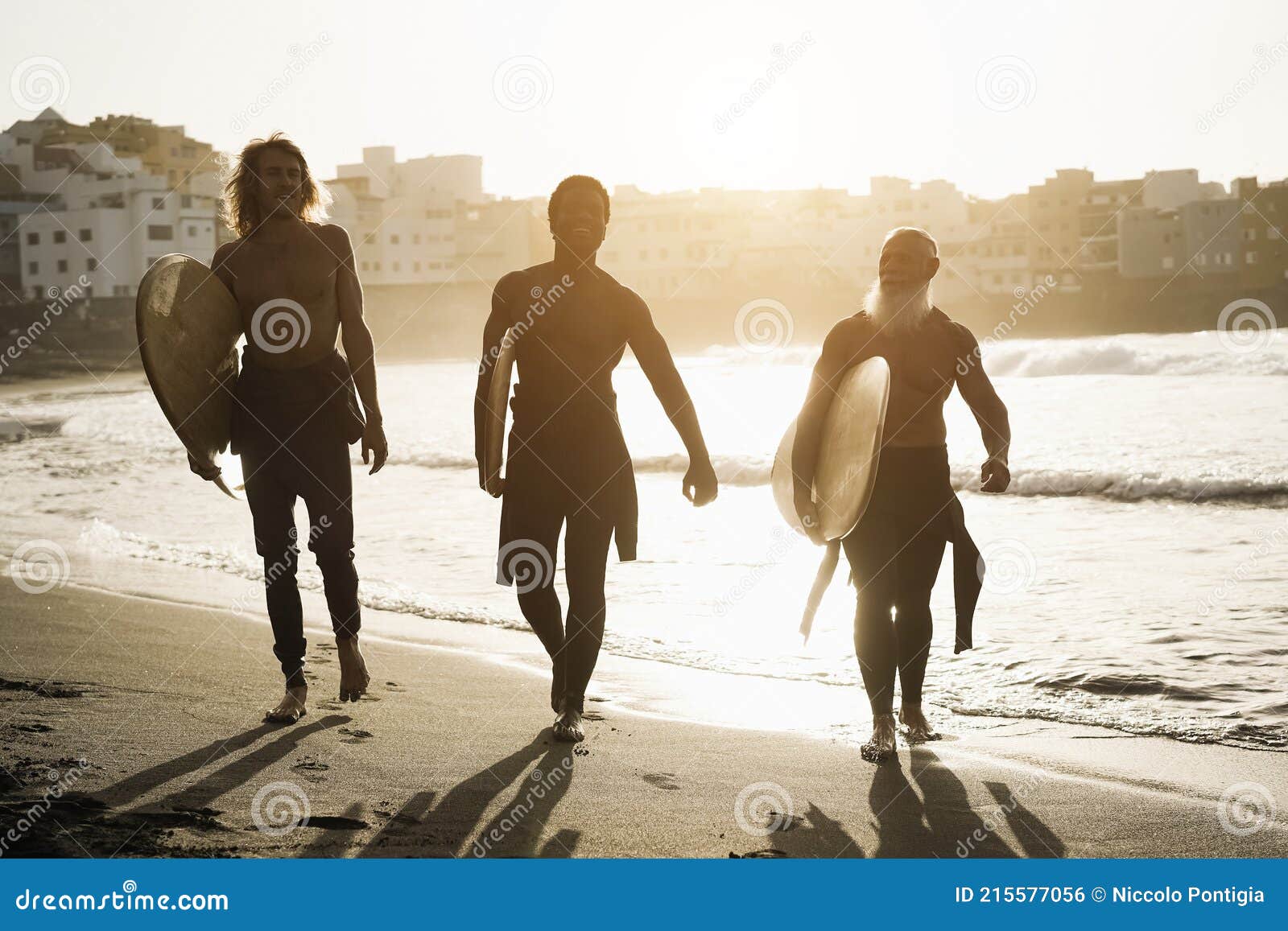 Multi Generational Surfer Friends Having Fun on the Beach after Surf ...