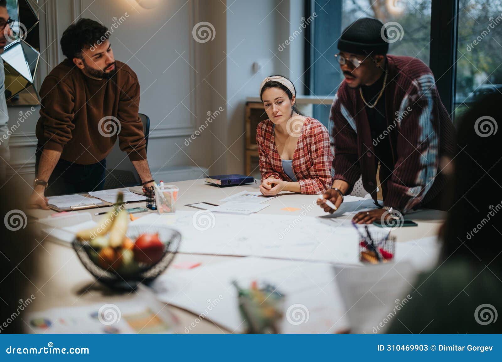 Multi Generational Team of Professionals Engaged in a Creative ...