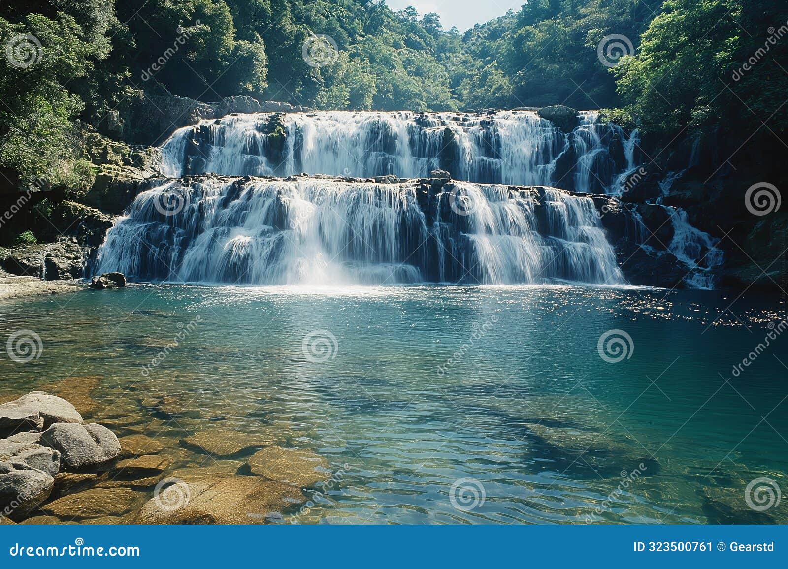 Multi-level Waterfall Cascading into Pristine Blue Pool. Stock Image ...