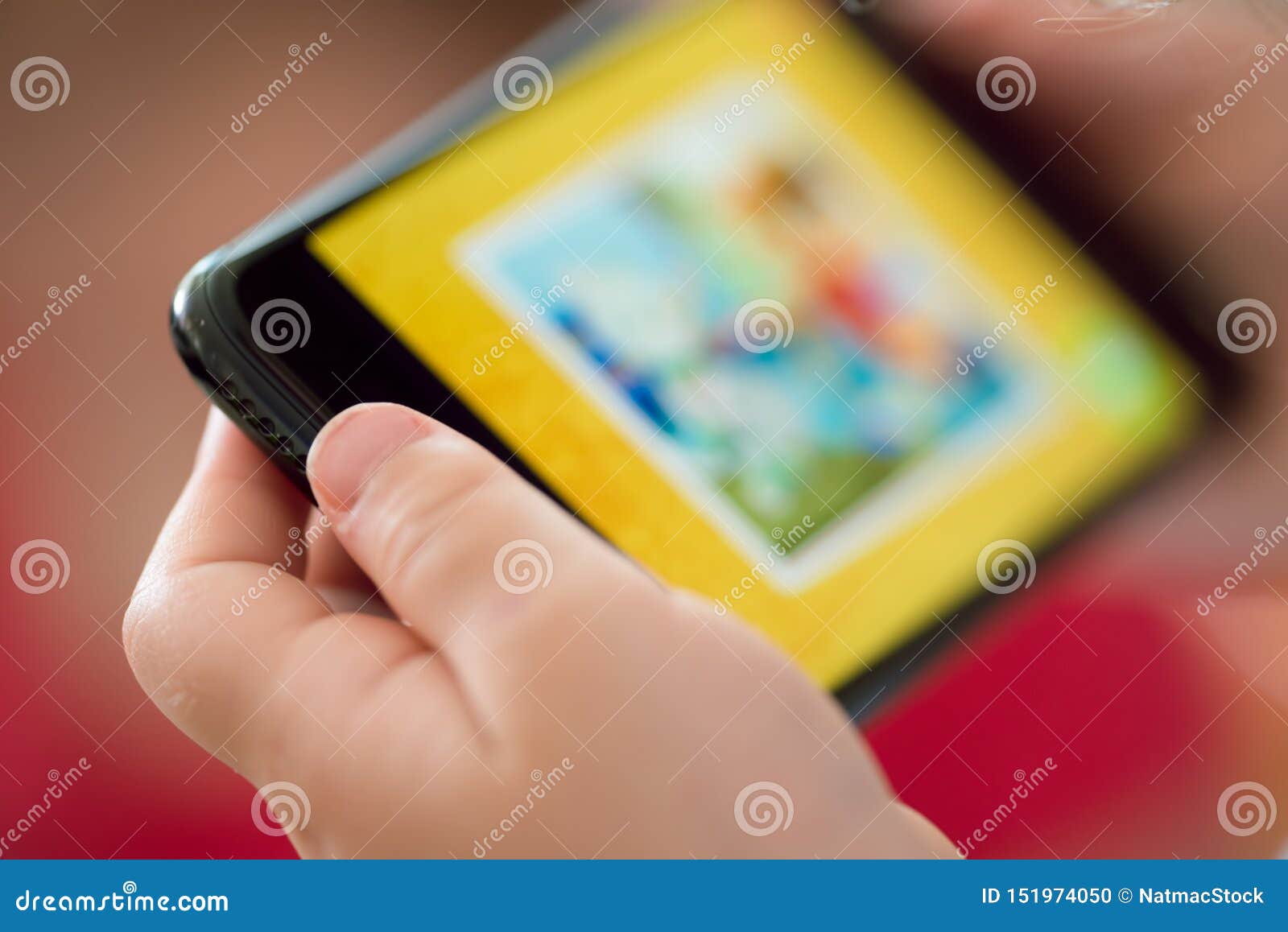 Multi-racial Girl Getting Screen Time Watching Content on a Cell Phone ... Multi-racial Girl Getting Screen Time Watching Content on a Cell Phone ...