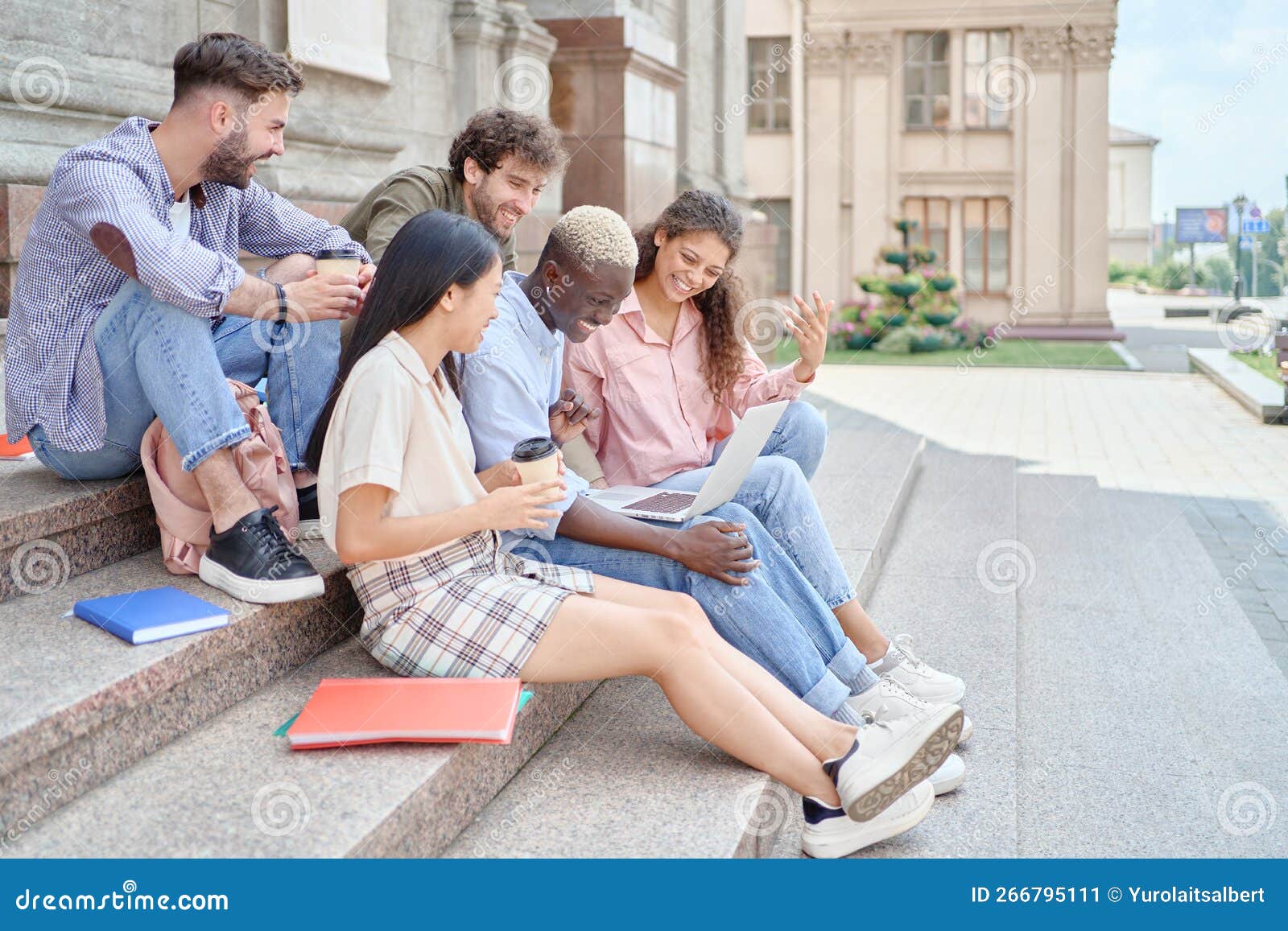 Multi-racial Group of Students Sitting on the Steps of the Campus ...