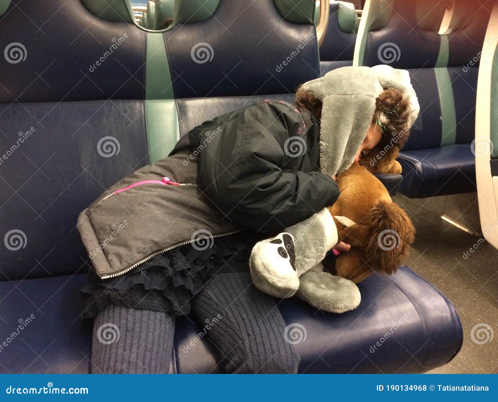 Multi Racial Tween Girl Sleeping on Train with Hat and Horse Stock ...