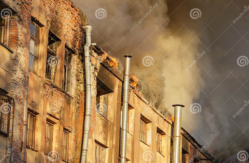 The Multi-storey Abandoned Building is Completely Engulfed in Fire and ...
