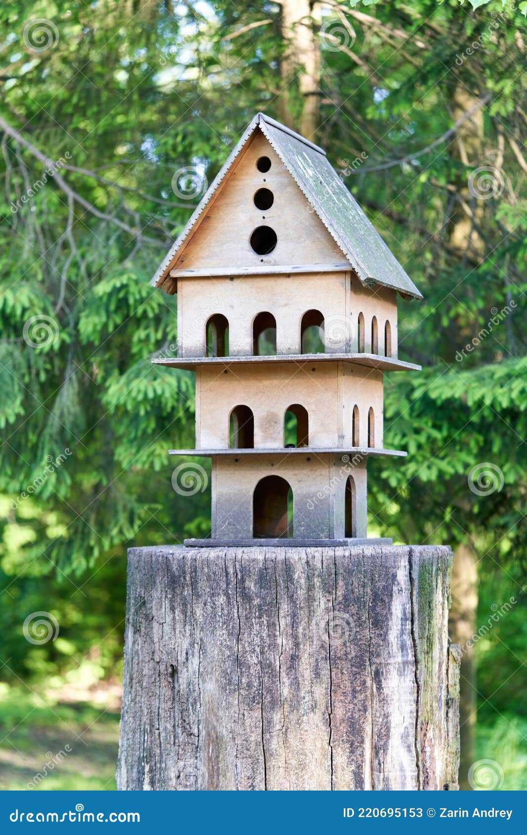 Multi Storey Bird House on a Tree Stump in the Park Stock Image - Image ...