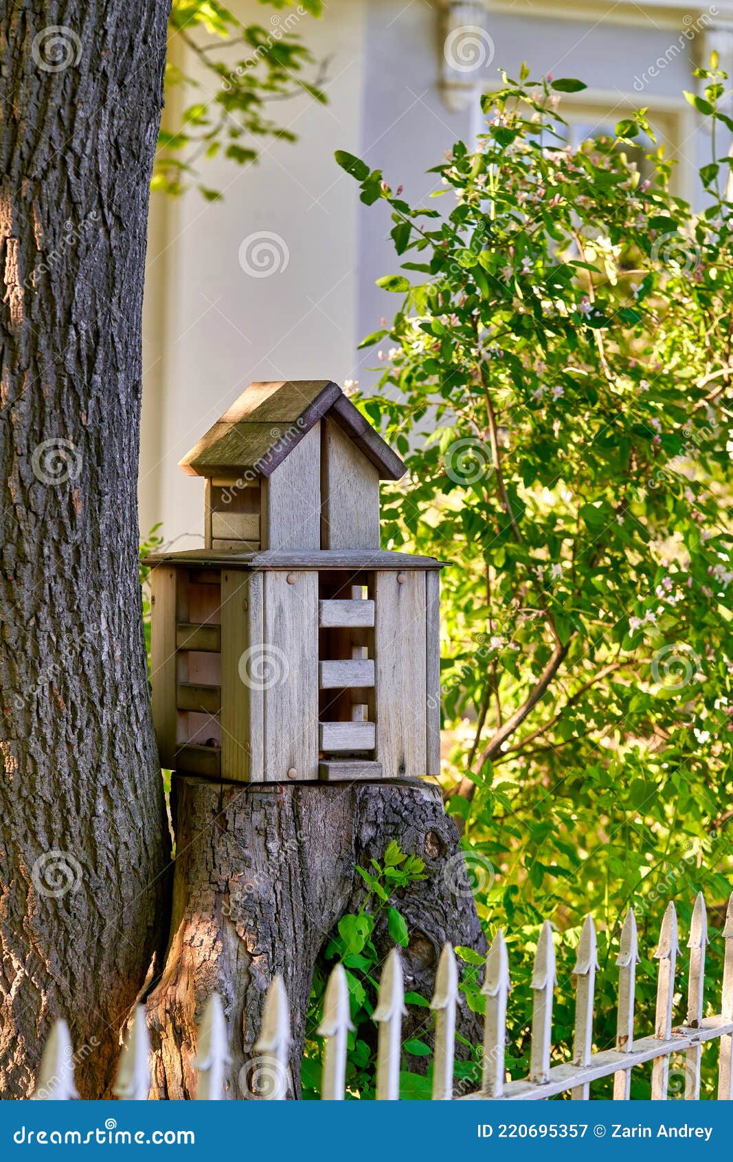Multi Storey Bird House on a Tree Stump in the Park Stock Image - Image ...