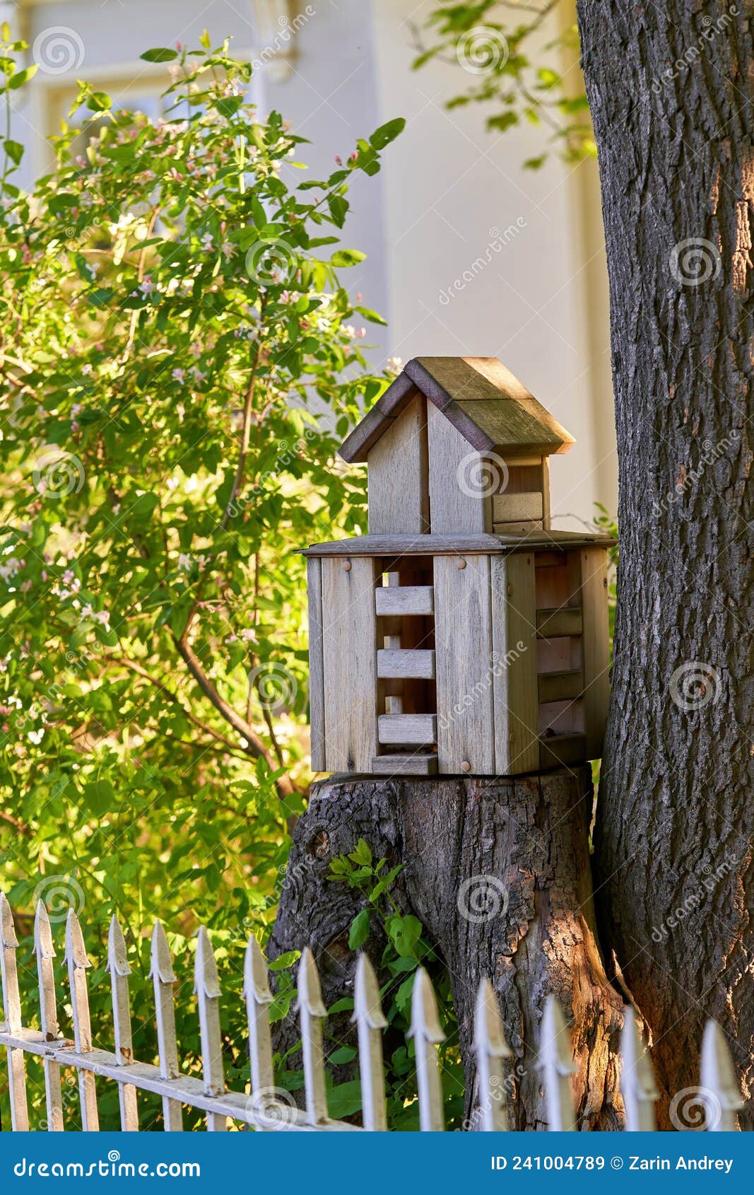 Multi Storey Bird House on a Tree Stump in the Park Stock Image - Image ...