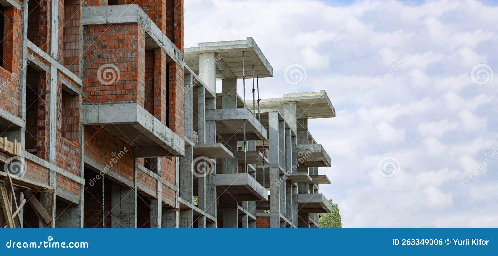 A Multi-storey Building Made of Monolithic and Red Brick Stock Photo ...