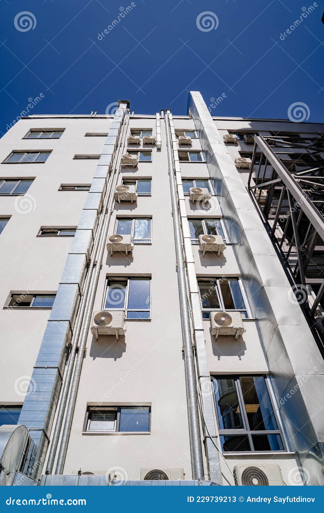 Multi-storey Building with Windows and External Air Conditioning Units ...