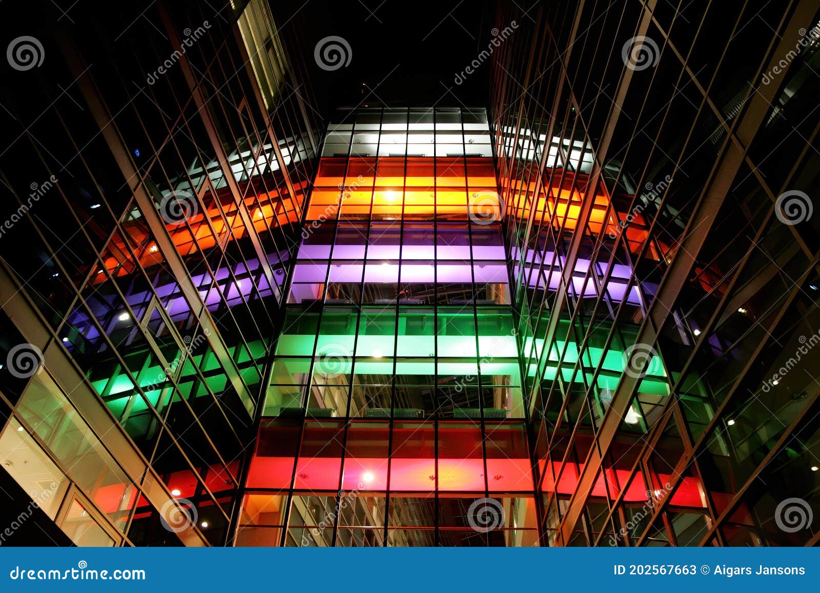 Multi-storey Glass Building Illuminated with Colored Lights at Night ...