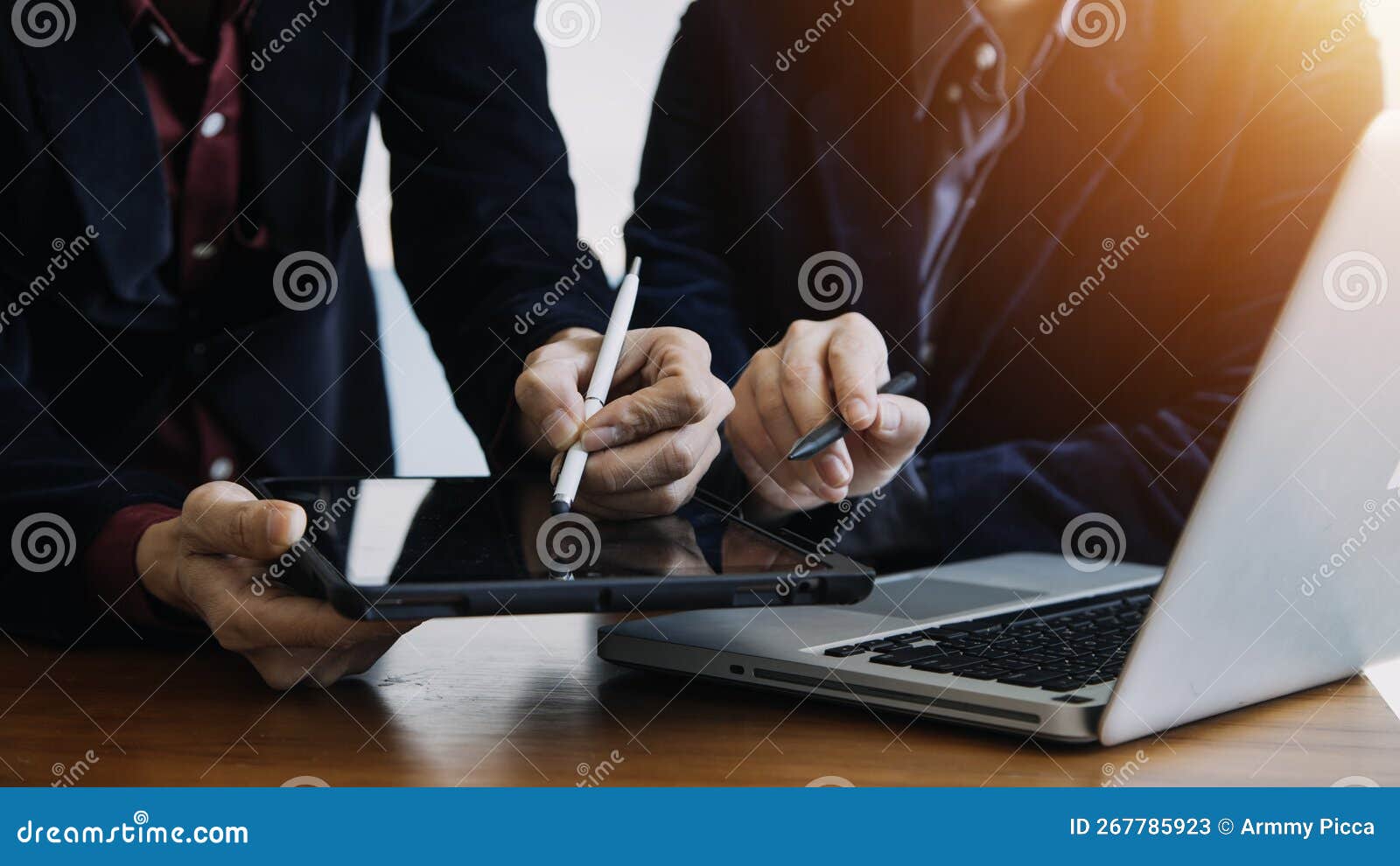 Multi-tasking Businessman Working in the Office. he is Using Touchpad ...
