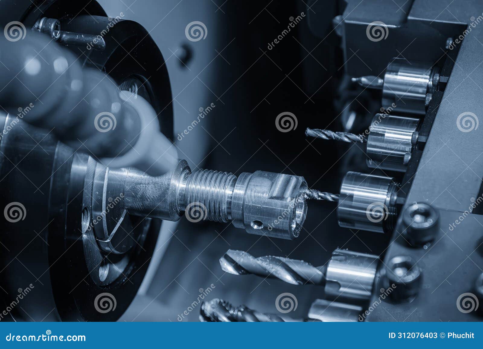 The Multi Tasking CNC Lathe Machine Swiss Type Tapping the Brass ...