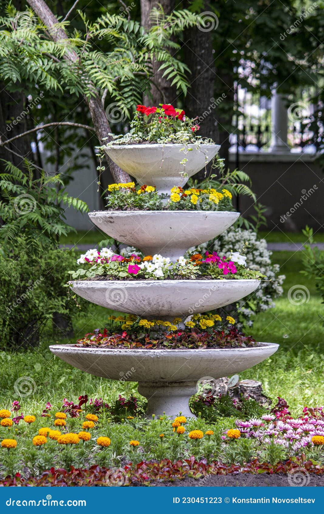 The Multi-Tiered Flower Bed Stock Image - Image of courtyard, green ...