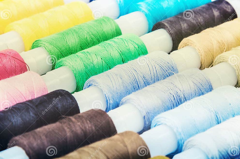Multicolor Bobbin Threads on Background Stock Photo - Image of ...