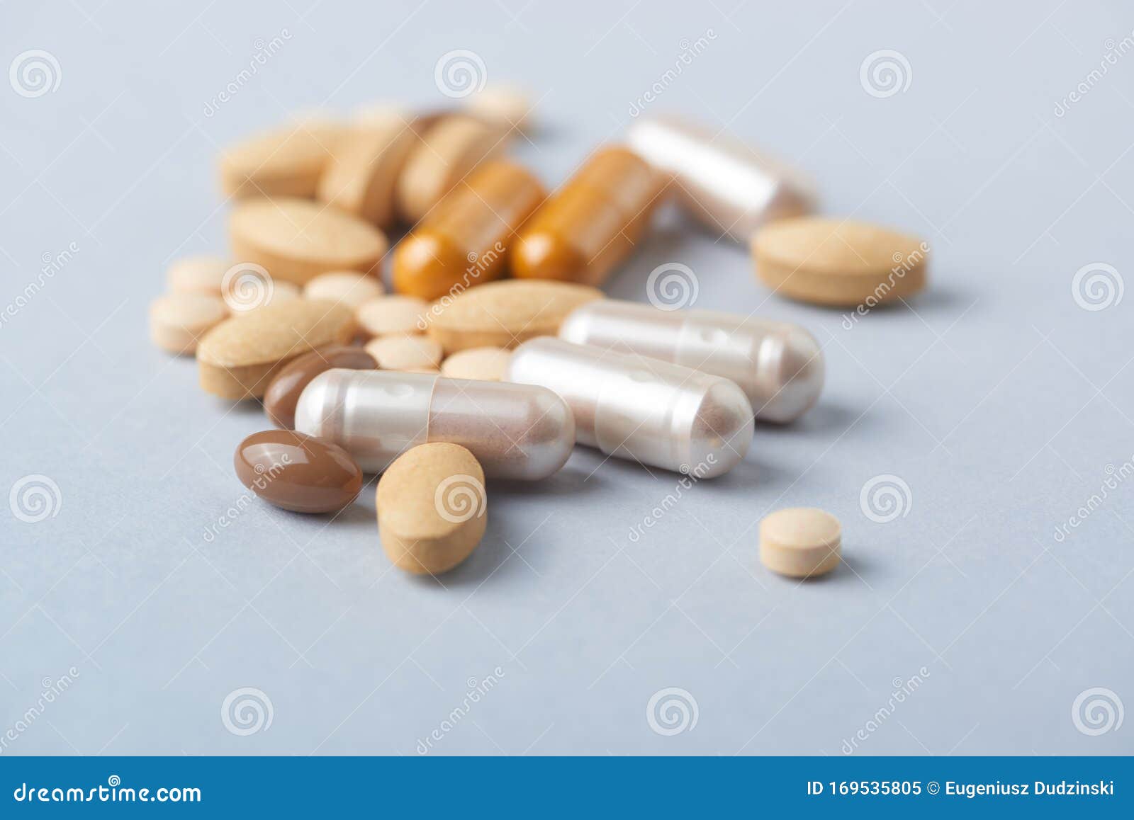 Multicolor Vitamins and Supplements on Bright Paper Background. Stock ...