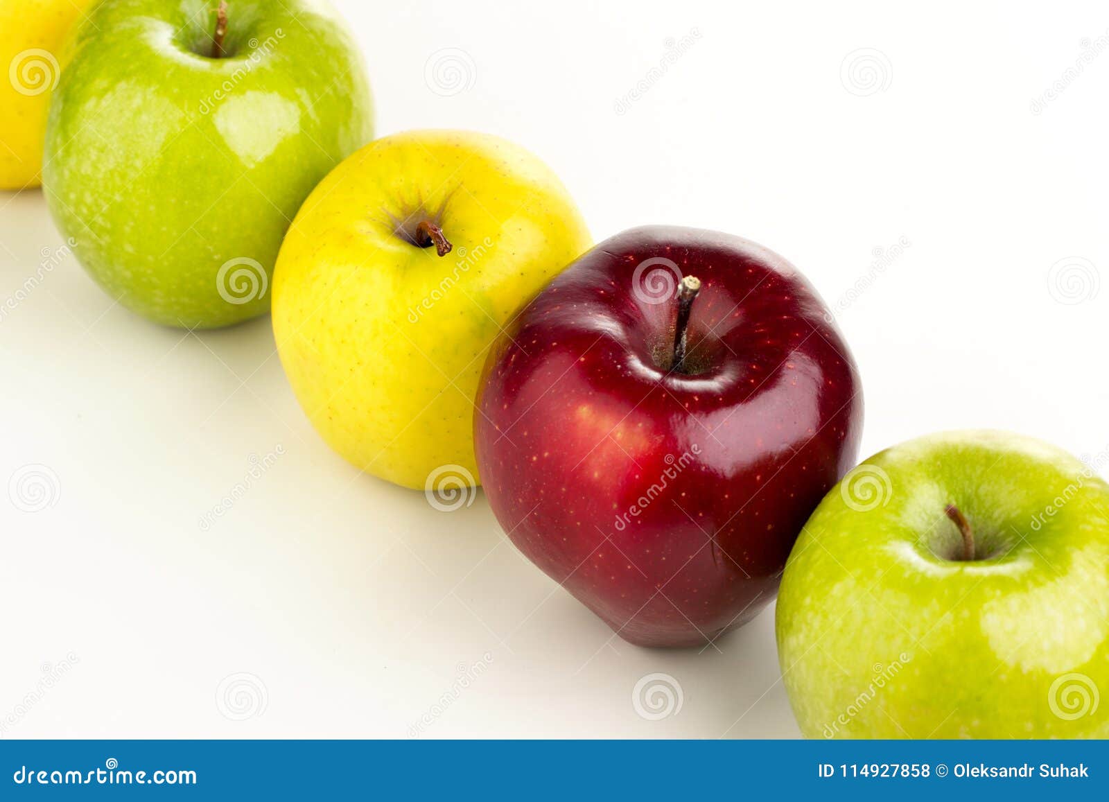 Multicolored Apples in a Row on a White Table Stock Photo - Image of ...