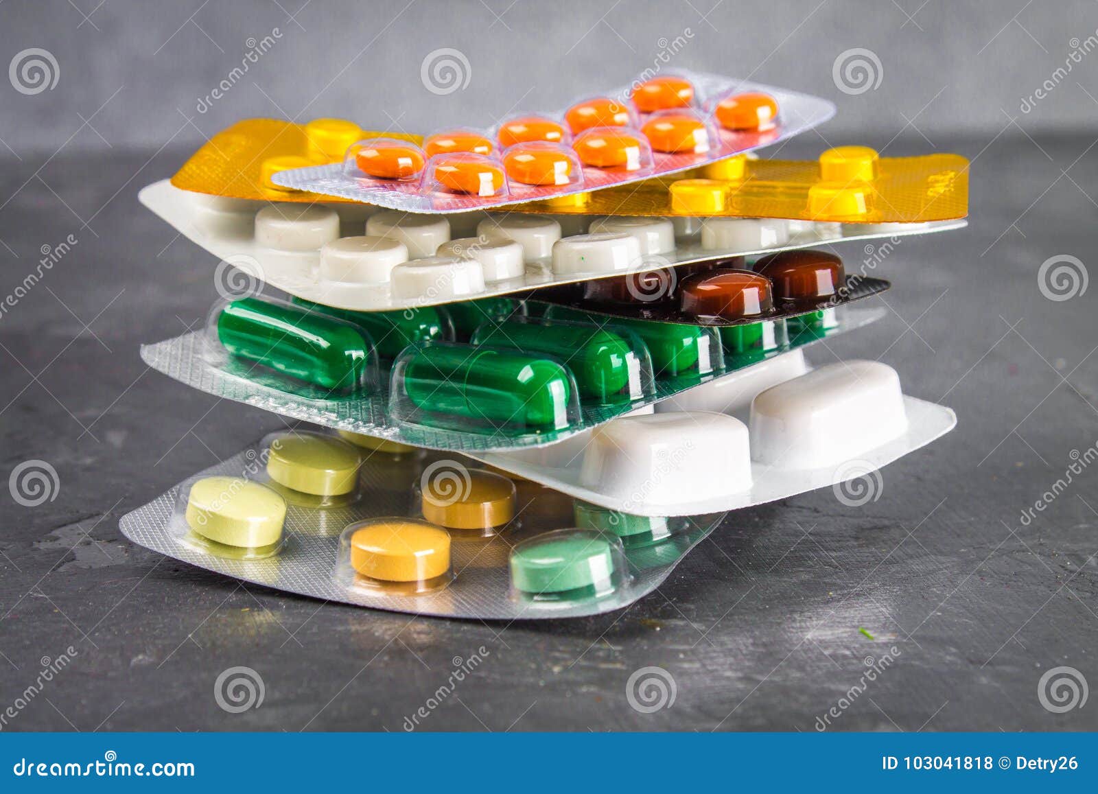 Multicolored Blisters of Tablets on a Gray Concrete Background. Stock ...