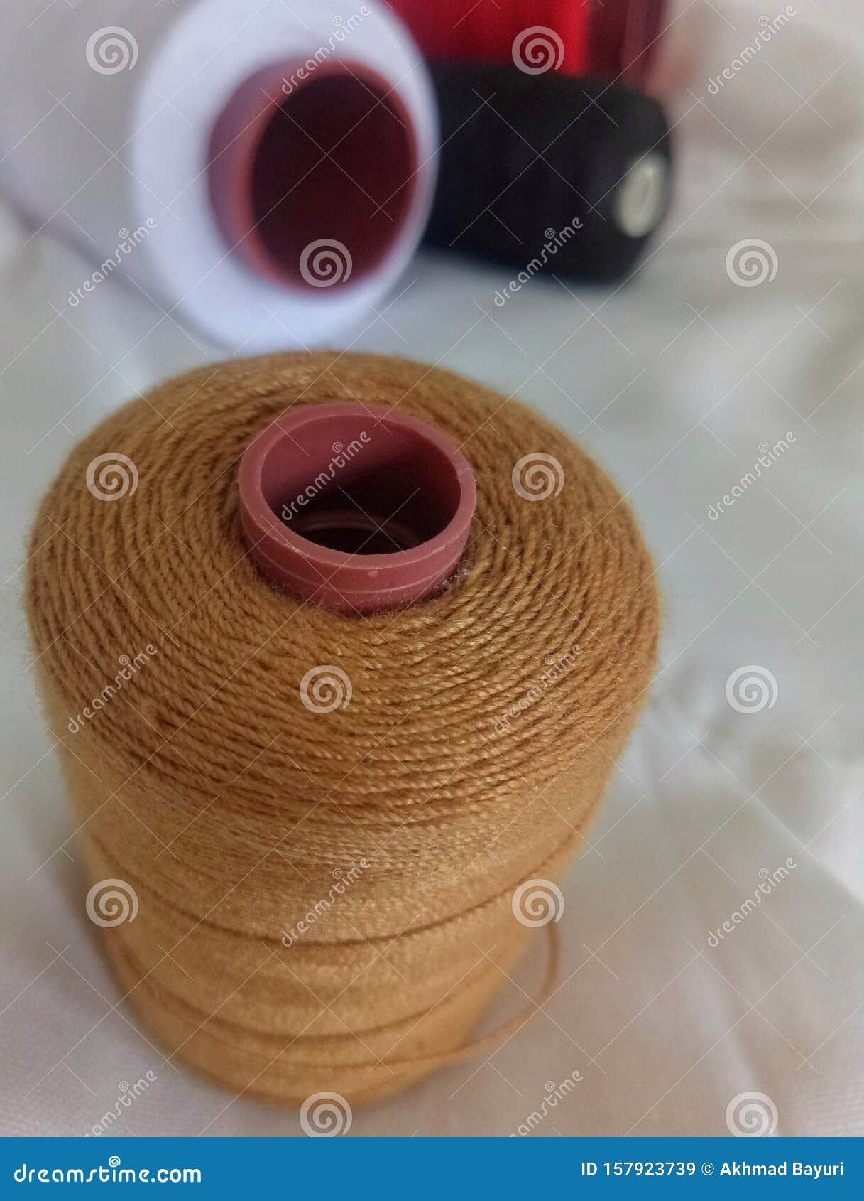 Multicolored Bunch of Sewing Thread on a White Cloth Stock Image ...