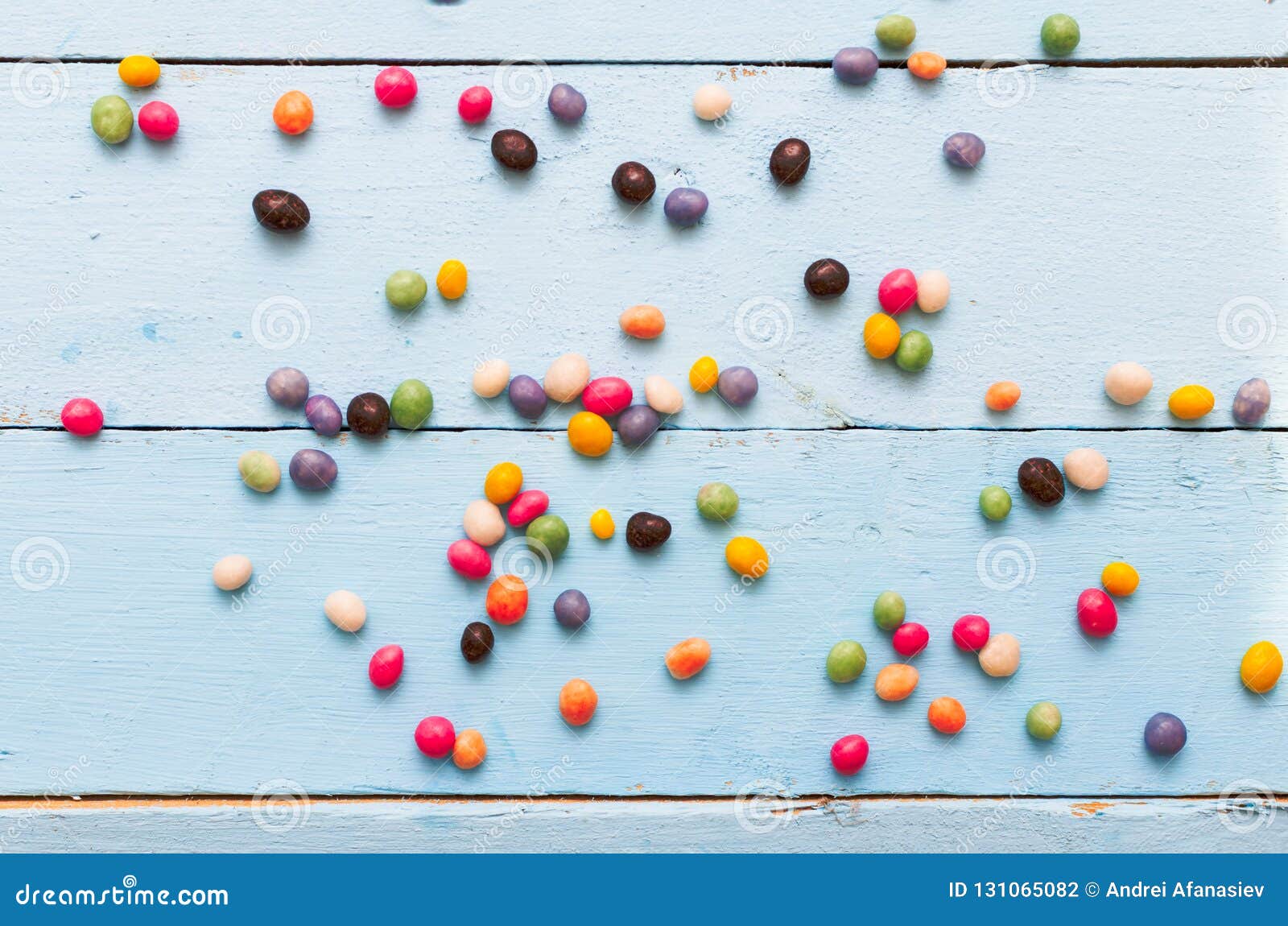 Multicolored Candies Scattered on a Wooden Table Stock Photo - Image of ...