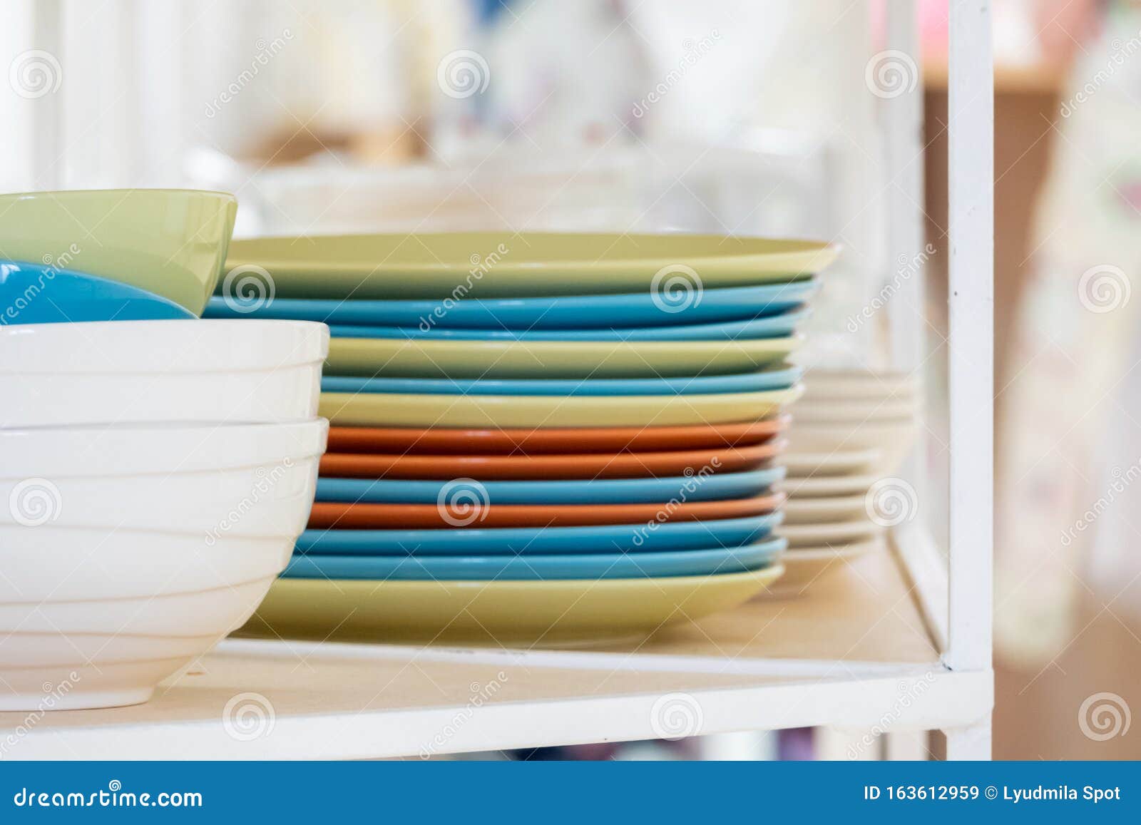 Multicolored Ceramic Plates Stacked on the Shelf Stock Image - Image of ...