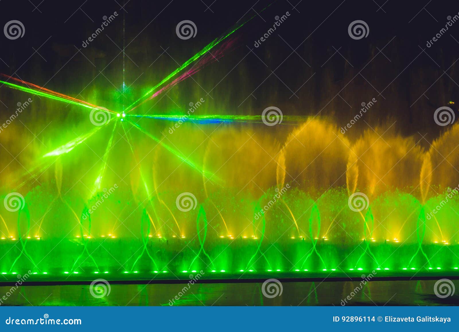 Multicolored Dancing Water Jet Fountain in the Dark Stock Photo - Image ...