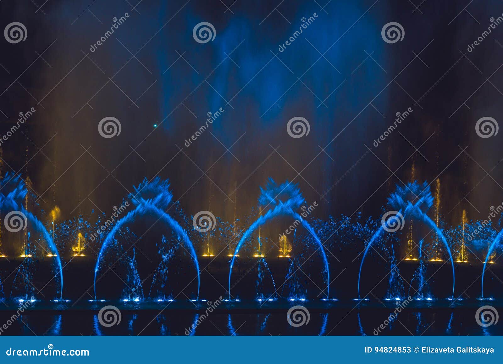 Multicolored Dancing Water Jet Fountain in the Dark Stock Image - Image ...