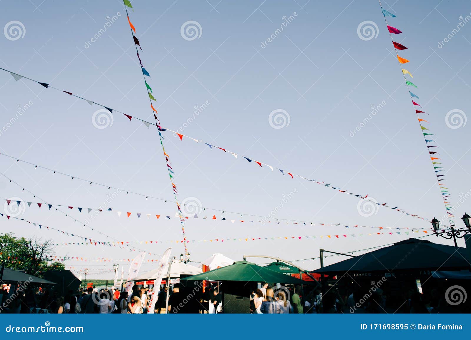 Multicolored Flags Flutter in the Wind Over a Street Fair Stock Image ...